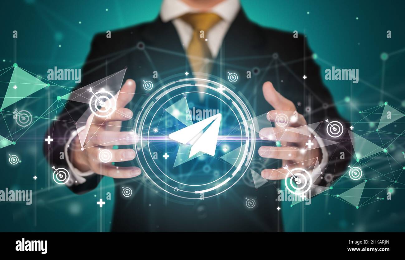 Businessman holdig business icons Stock Photo - Alamy