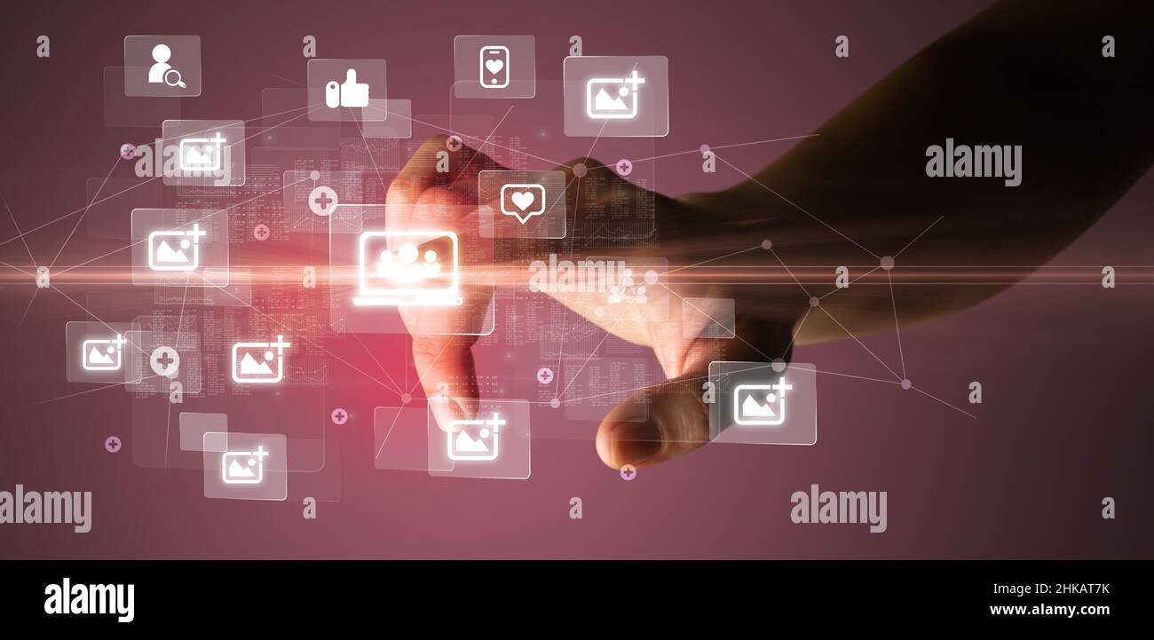 Hand pressing social media multimedia application screen with media ...