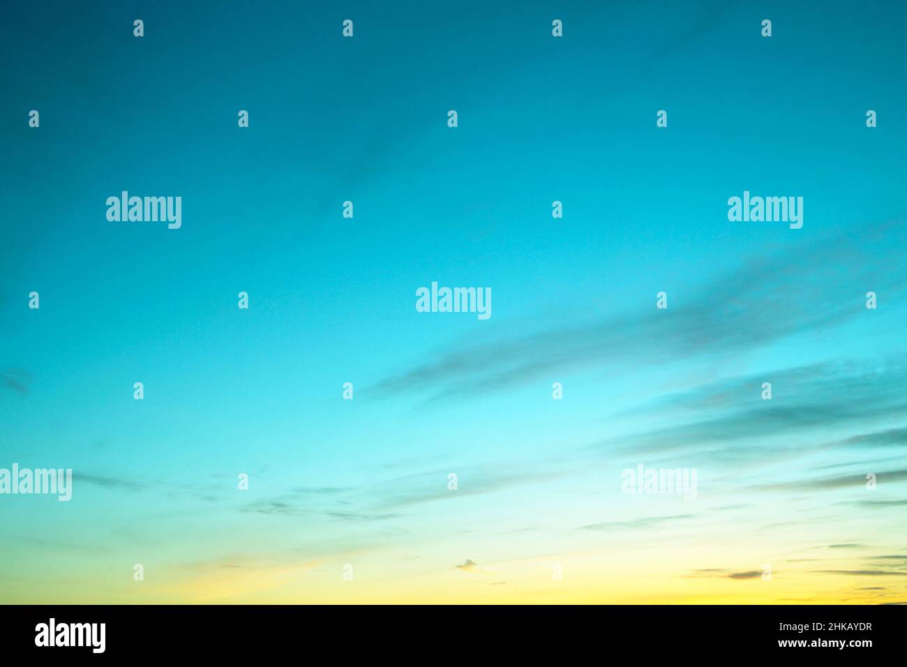 Clouds in the sky are illuminated from below by the light of the sun ...