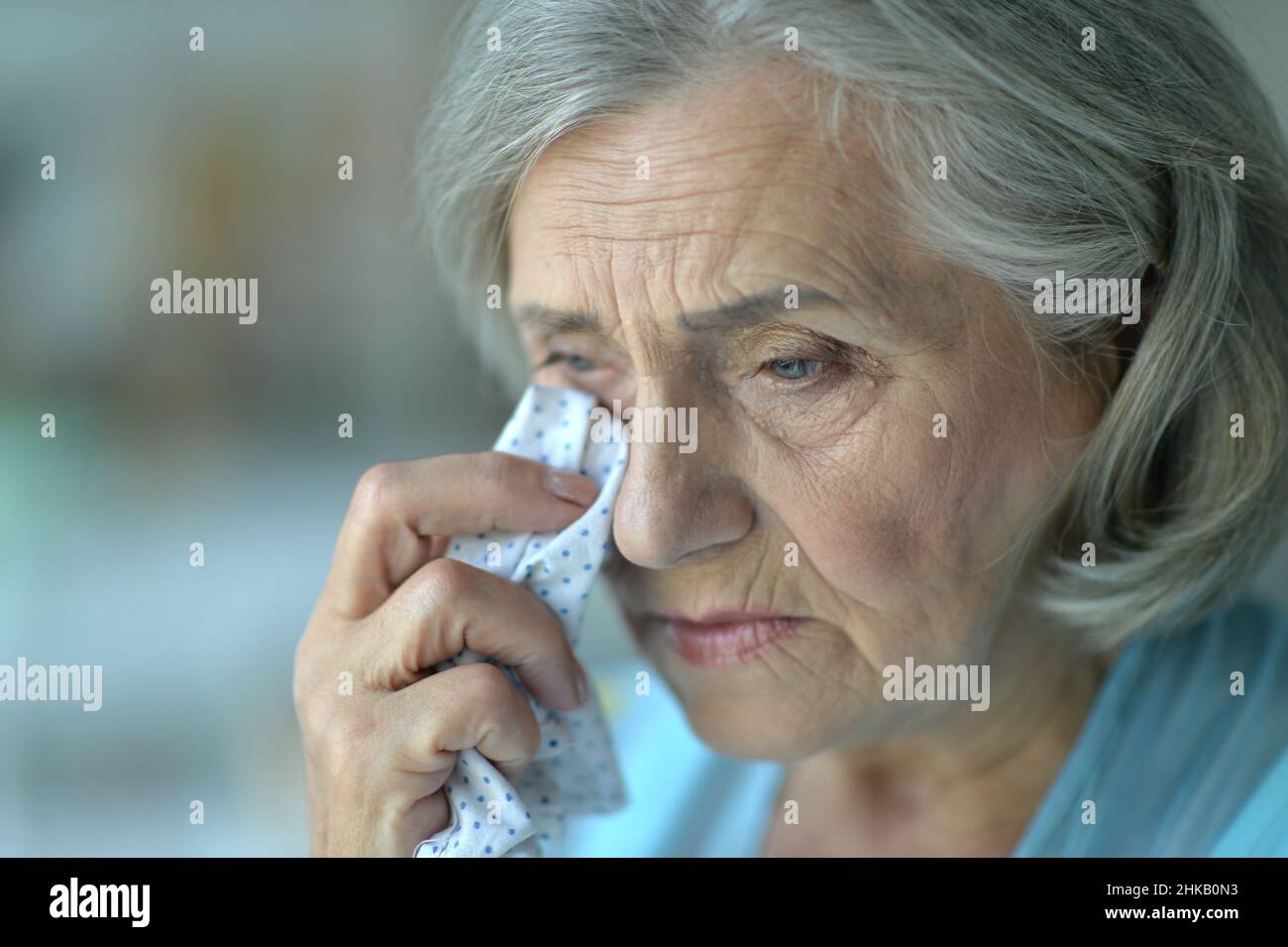Close up portrait of sick senior woman Stock Photo - Alamy