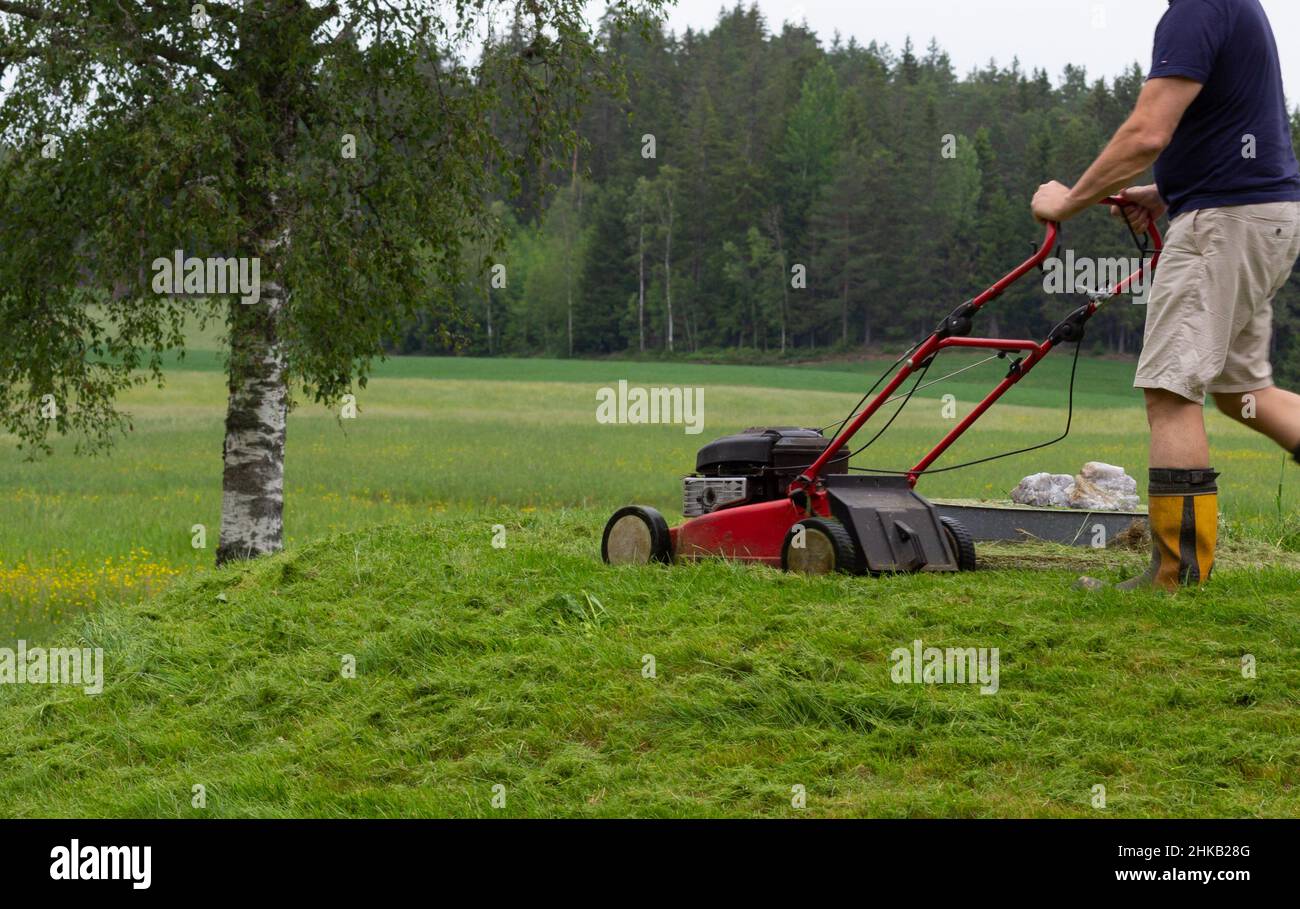 Maintenance man riding tractor hi-res stock photography and images - Alamy