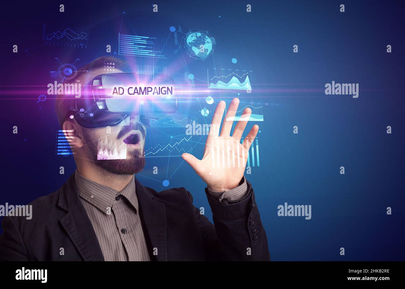 Businessman looking through Virtual Reality glasses Stock Photo - Alamy