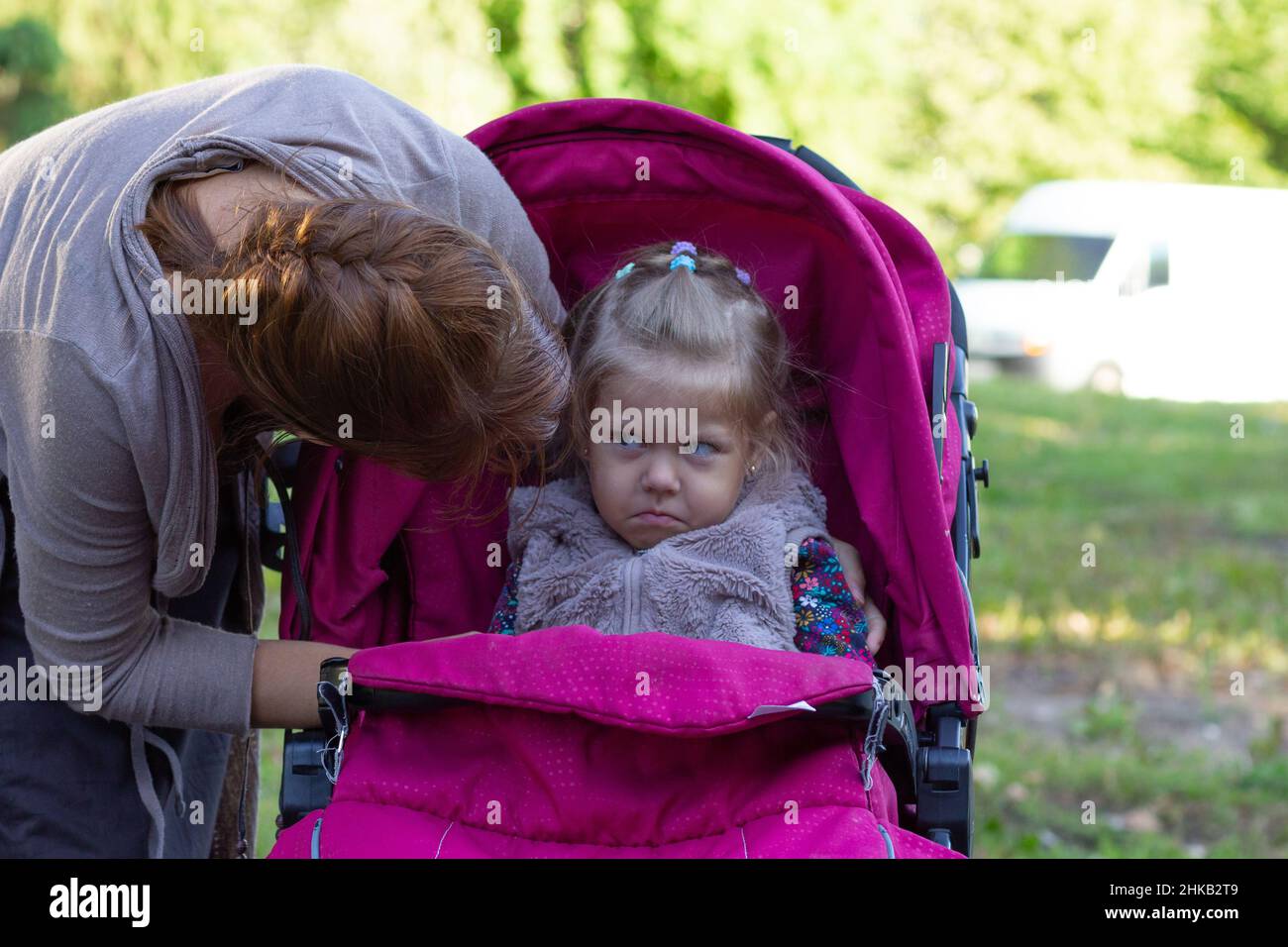 Woman looking at offended little girl Stock Photo - Alamy