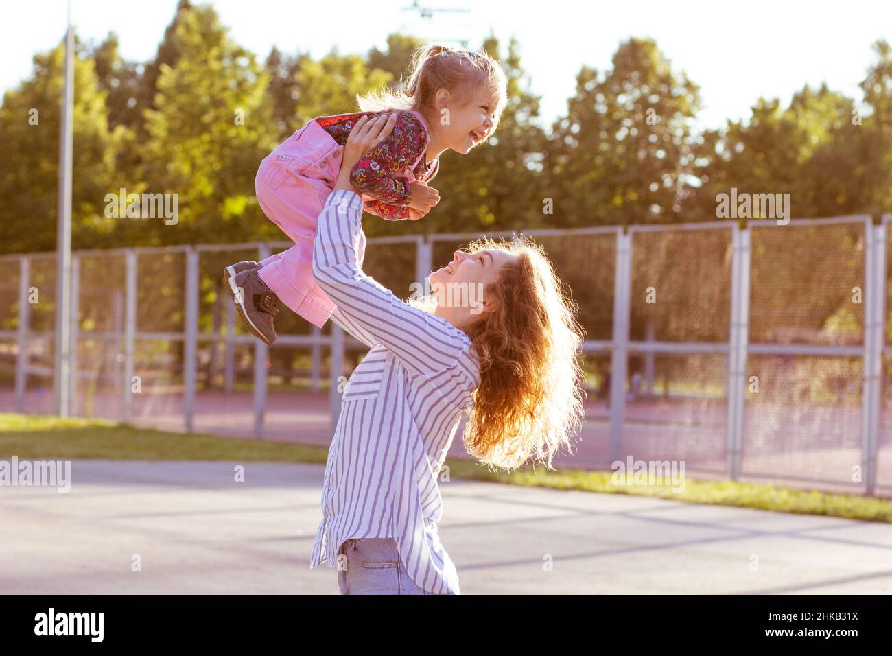 Happy young girl rising up to sky smiling and beautiful child Stock ...