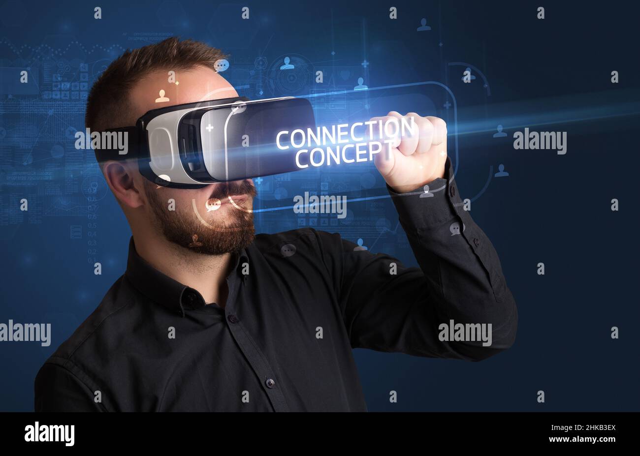 Businessman looking through Virtual Reality glasses, social media ...