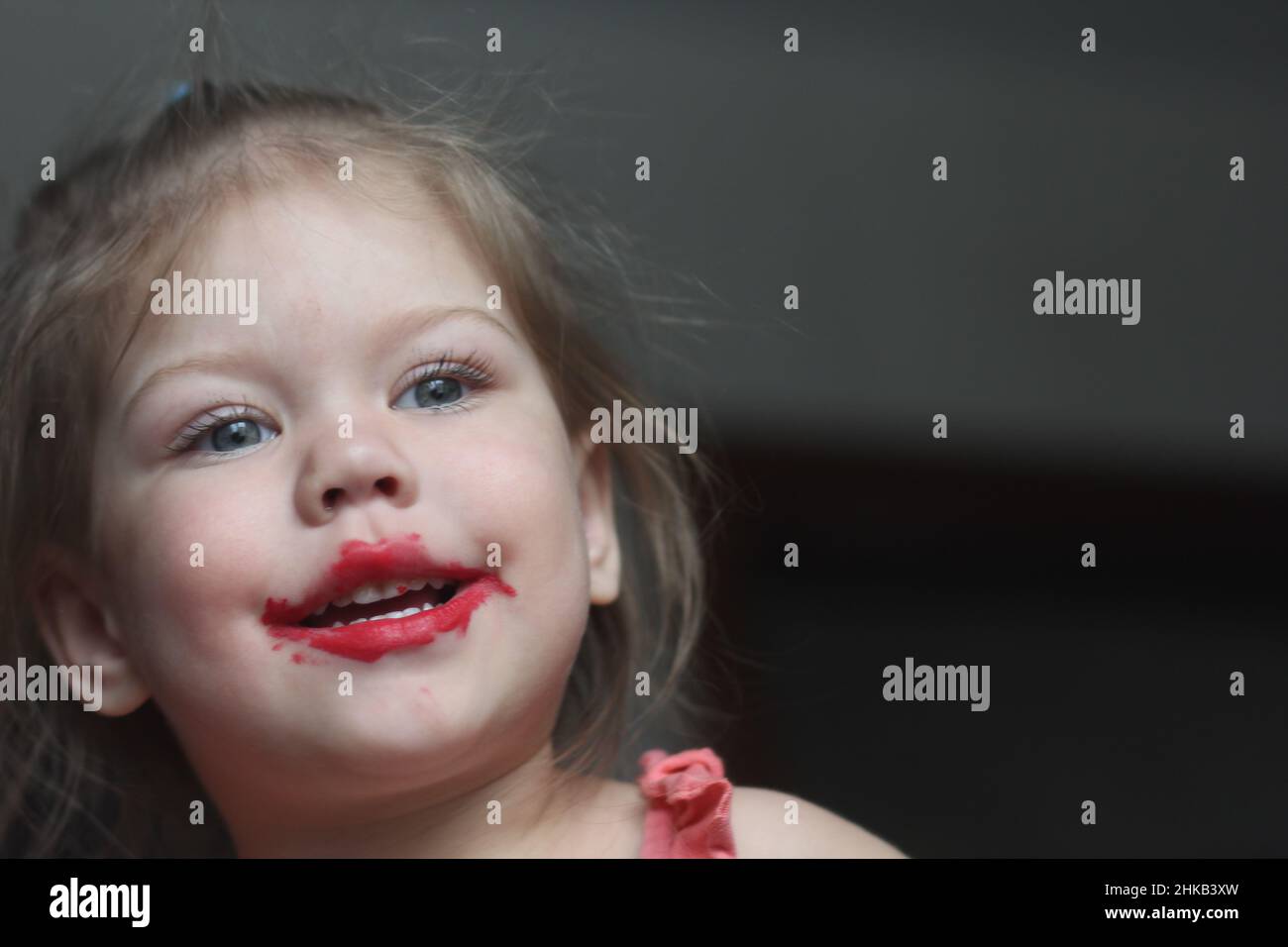 Little child play lipstick hi-res stock photography and images - Alamy