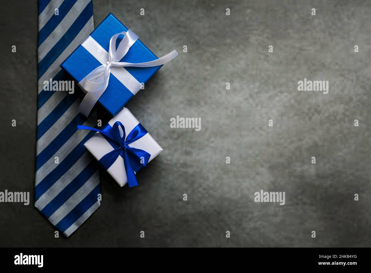 Happy Father's Day. Top view of gifts boxes, necktie and copy space ...