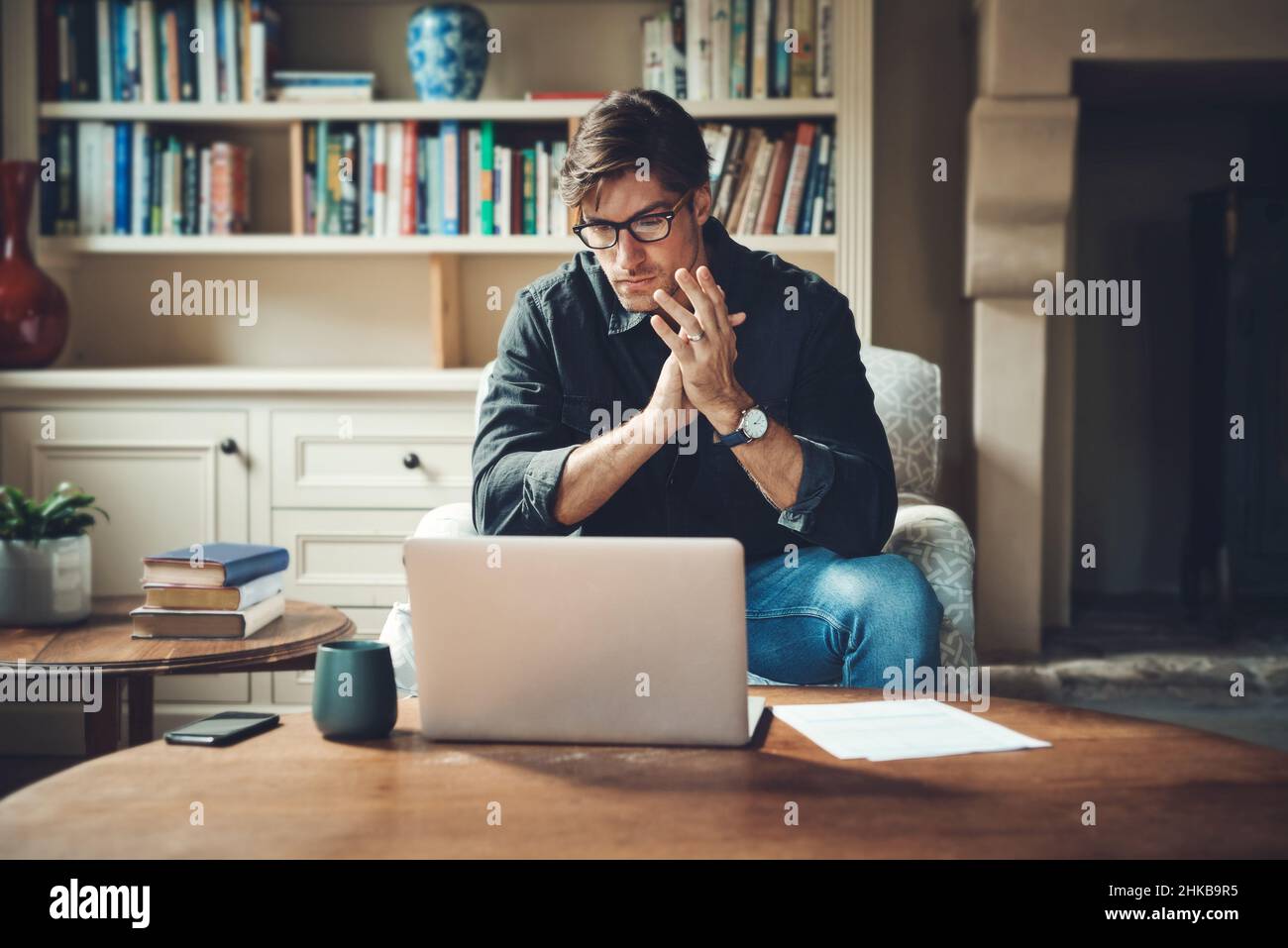 Conjuring up a plan for success. Shot of a handsome young businessman ...
