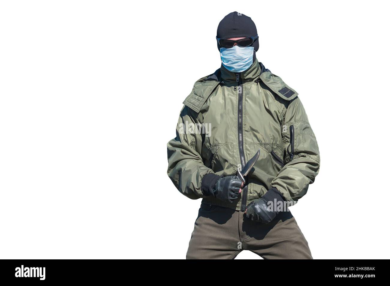 Armed criminal in a mask with a knife on a white background Stock Photo ...