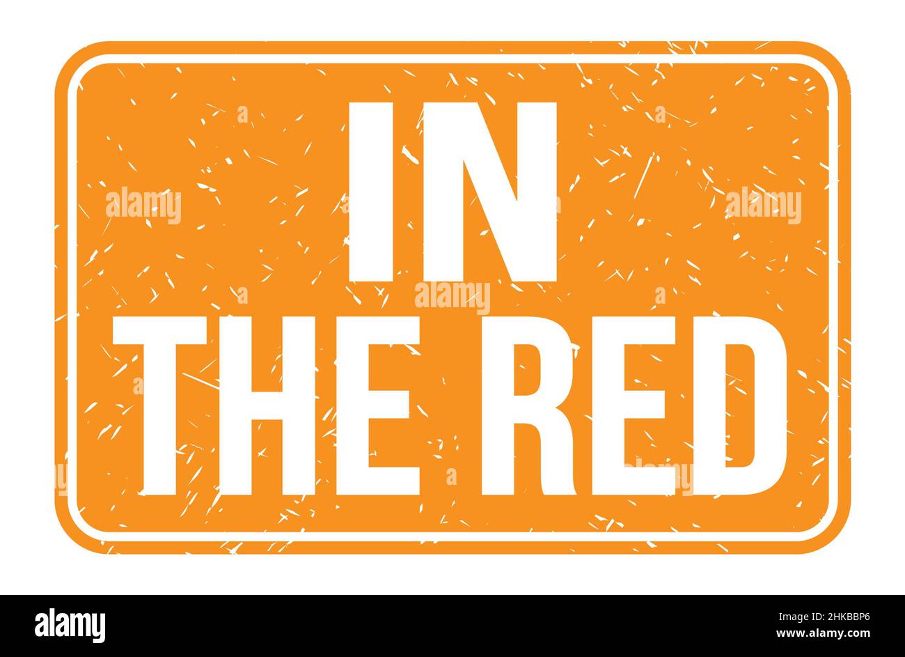 IN THE RED, words written on orange rectangle stamp sign Stock Photo ...
