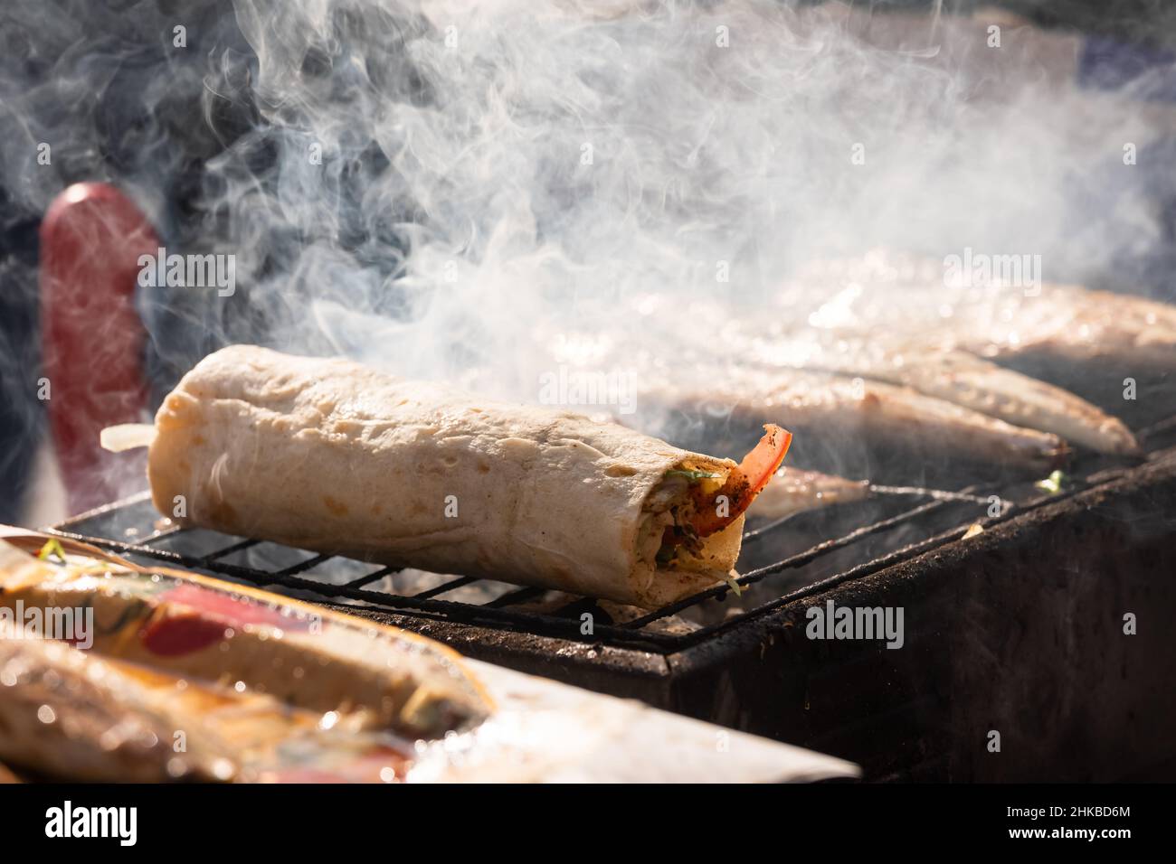 Making Balik Ekmek on wood fire in Istanbul, Turkey, a traditional ...