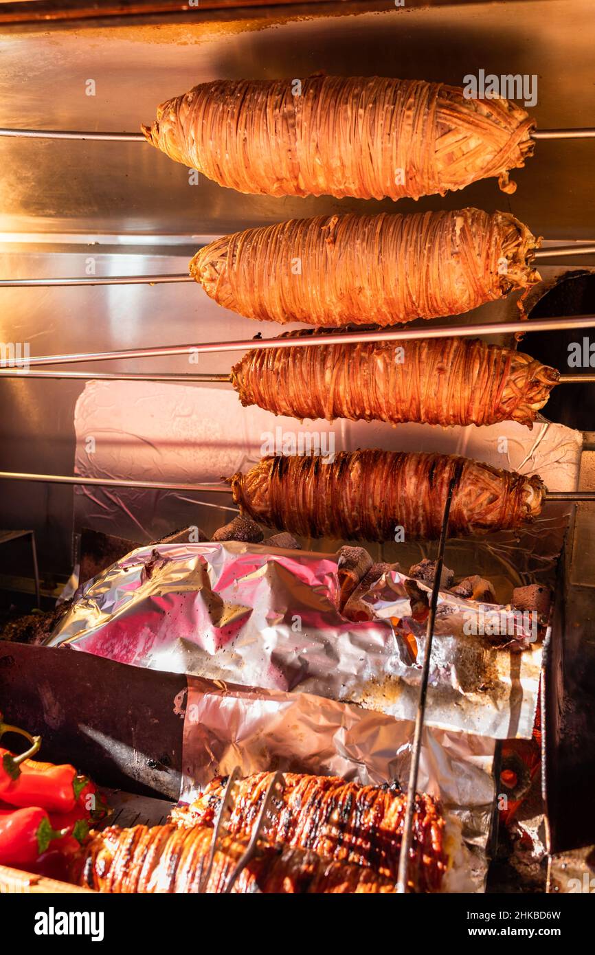 Rolls of Kokorech (Kokorec) roasting on wood fire in Istanbul, Turkey ...