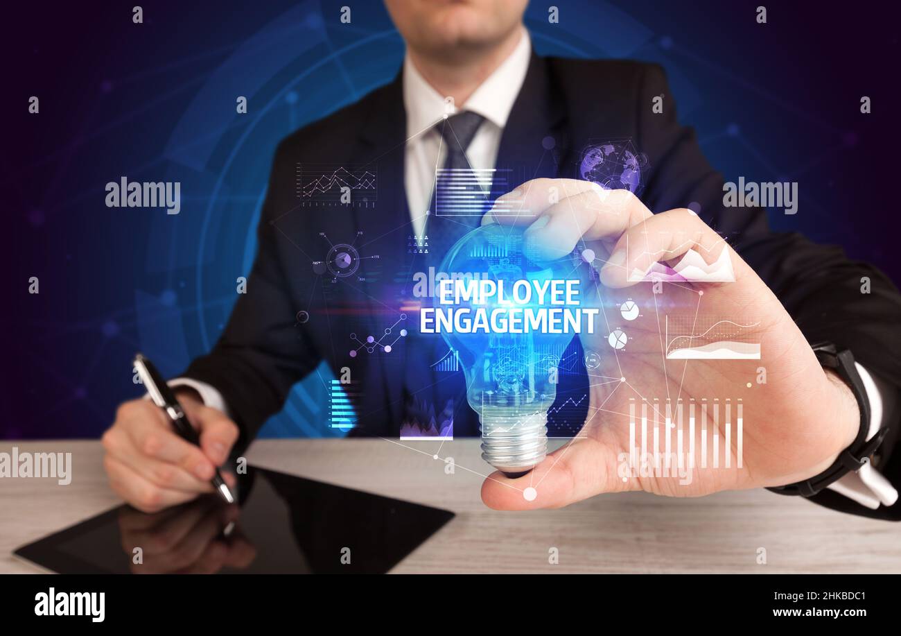 Businessman holding a light bulb, new business concept Stock Photo - Alamy