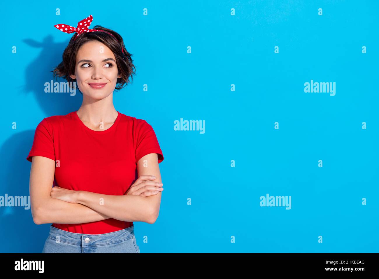 Photo of youth pretty lady wonder think look empty space folded hands ...