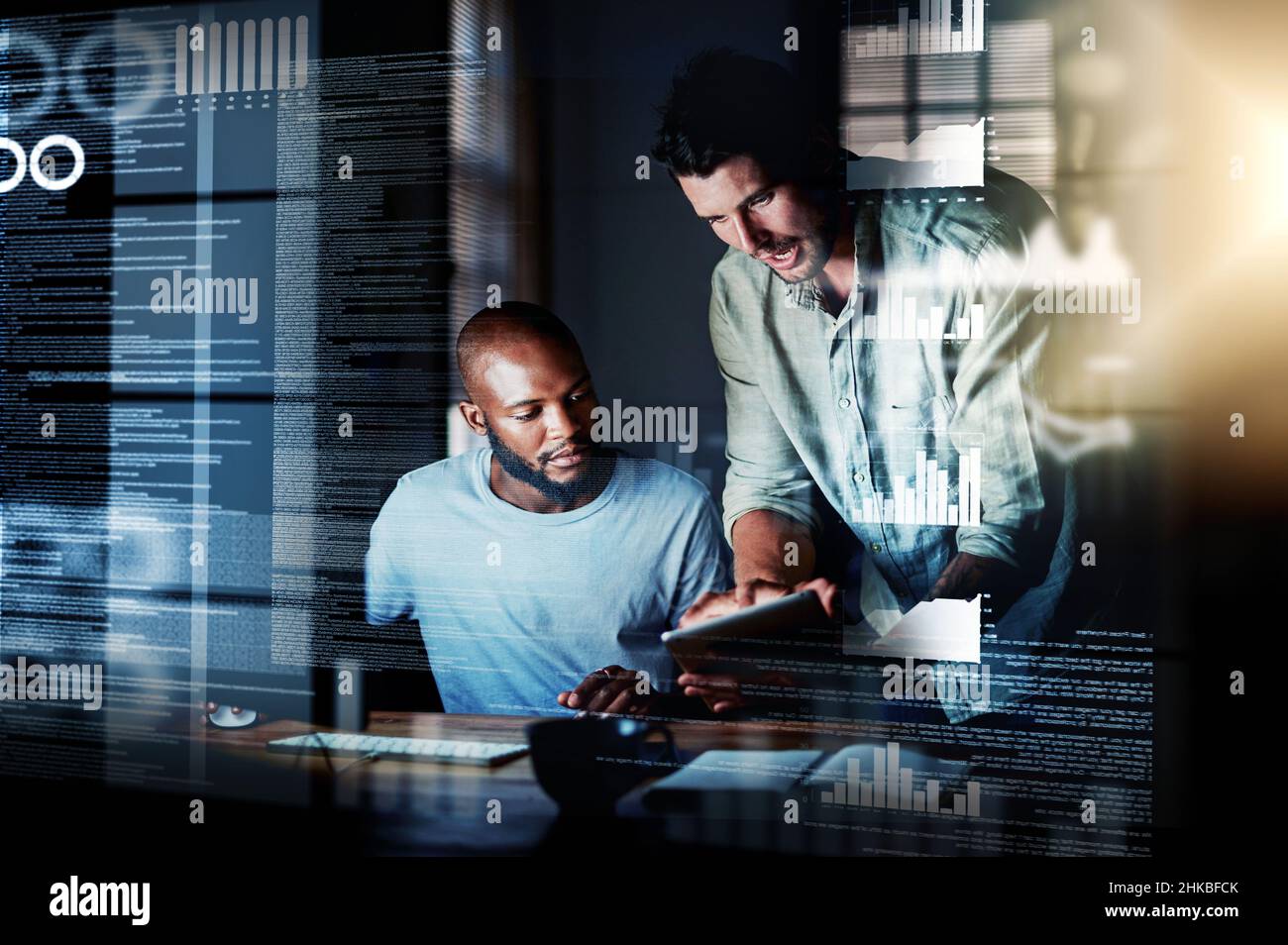 This algorithm should work. Shot of two programmers using a digital tablet while working ...