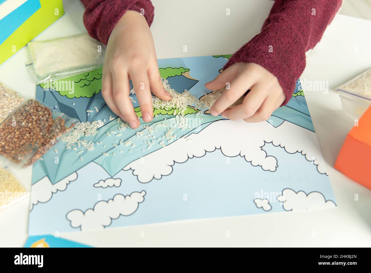 development of fine motor skills. child makes picture of different ...