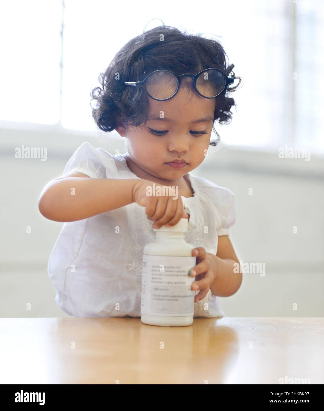 Learning as she grows. Shot of a cute little girl at home Stock Photo ...