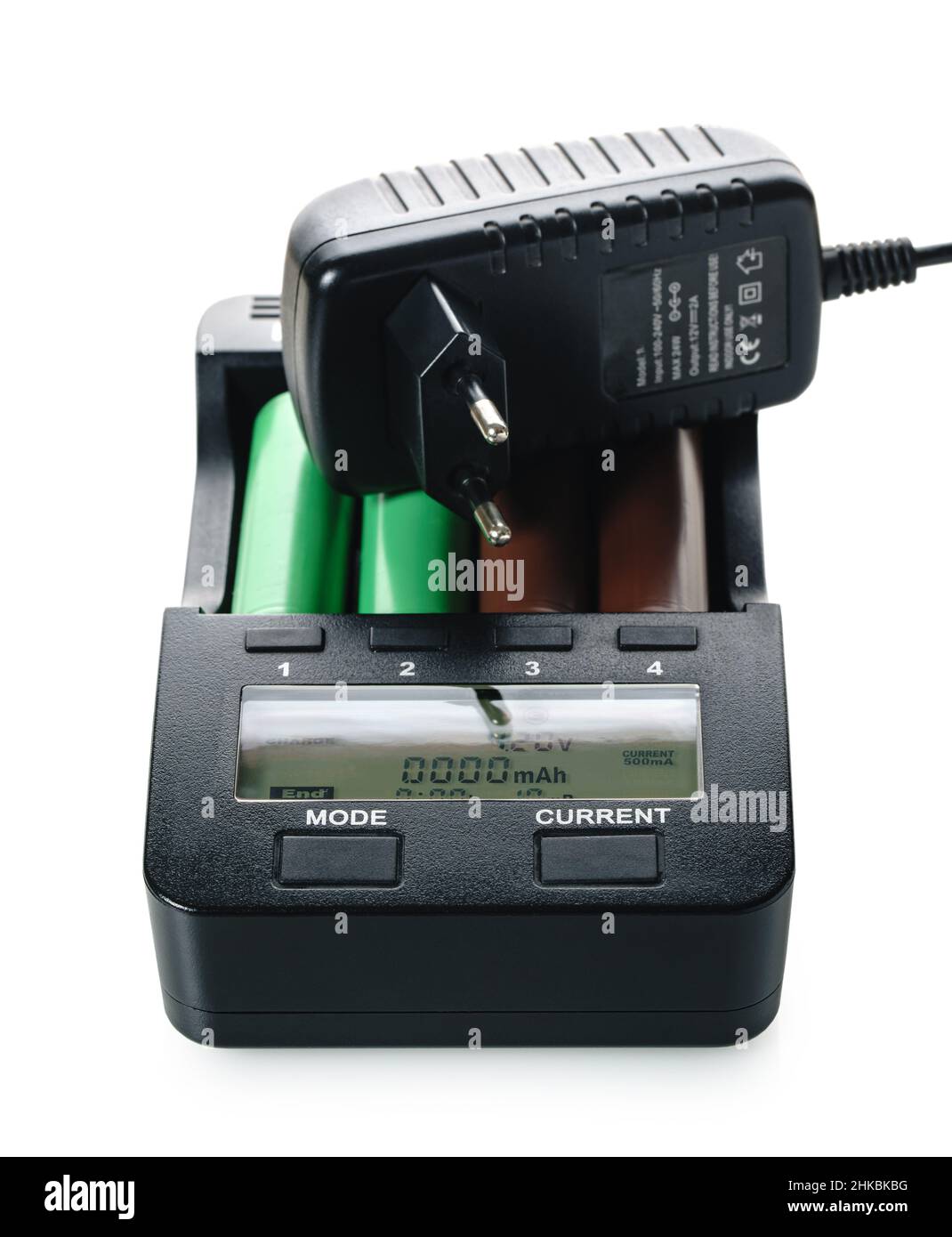 charger with batteries on a white isolated background Stock Photo - Alamy
