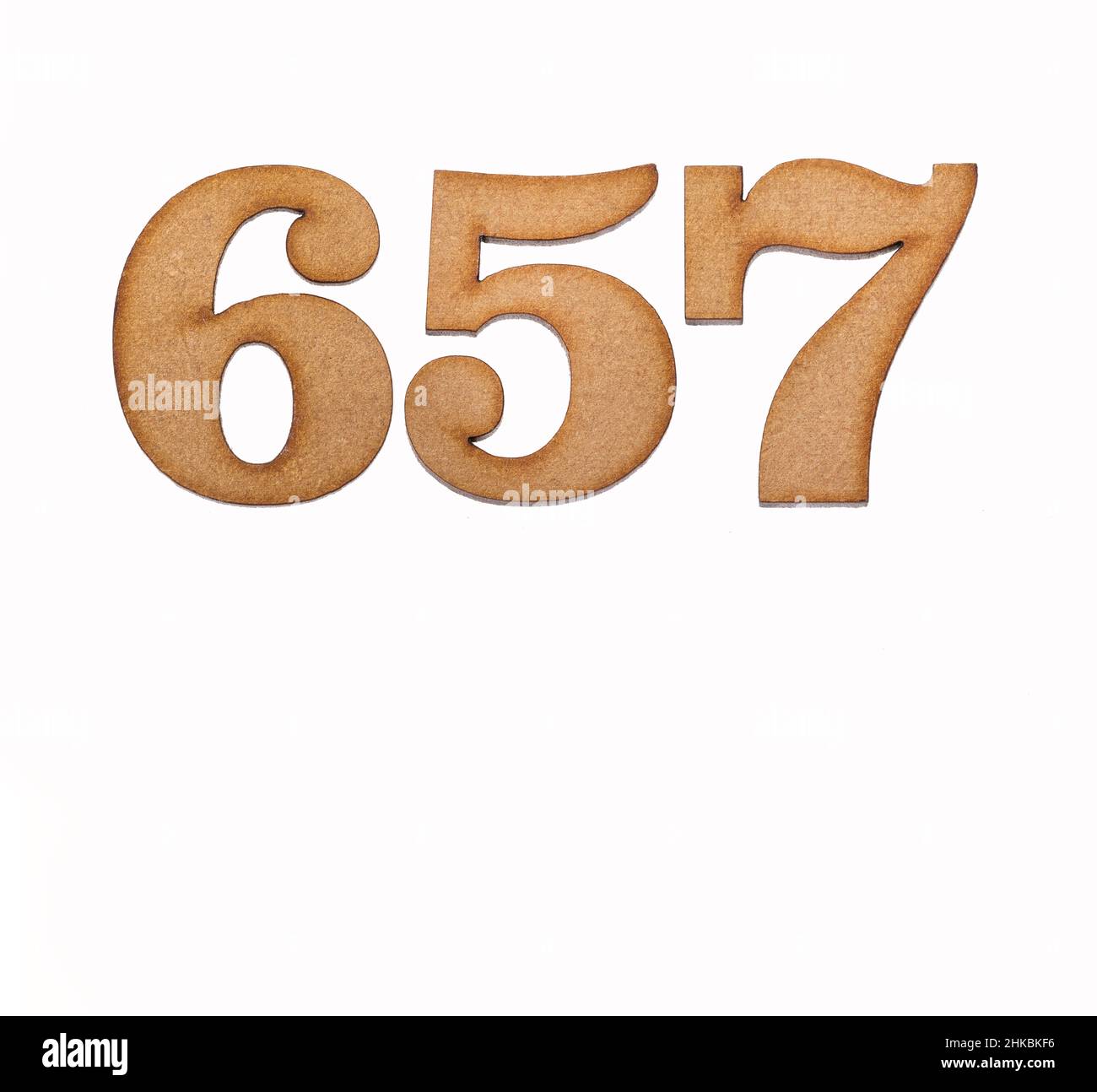 Number 657 in wood, isolated on white background Stock Photo - Alamy