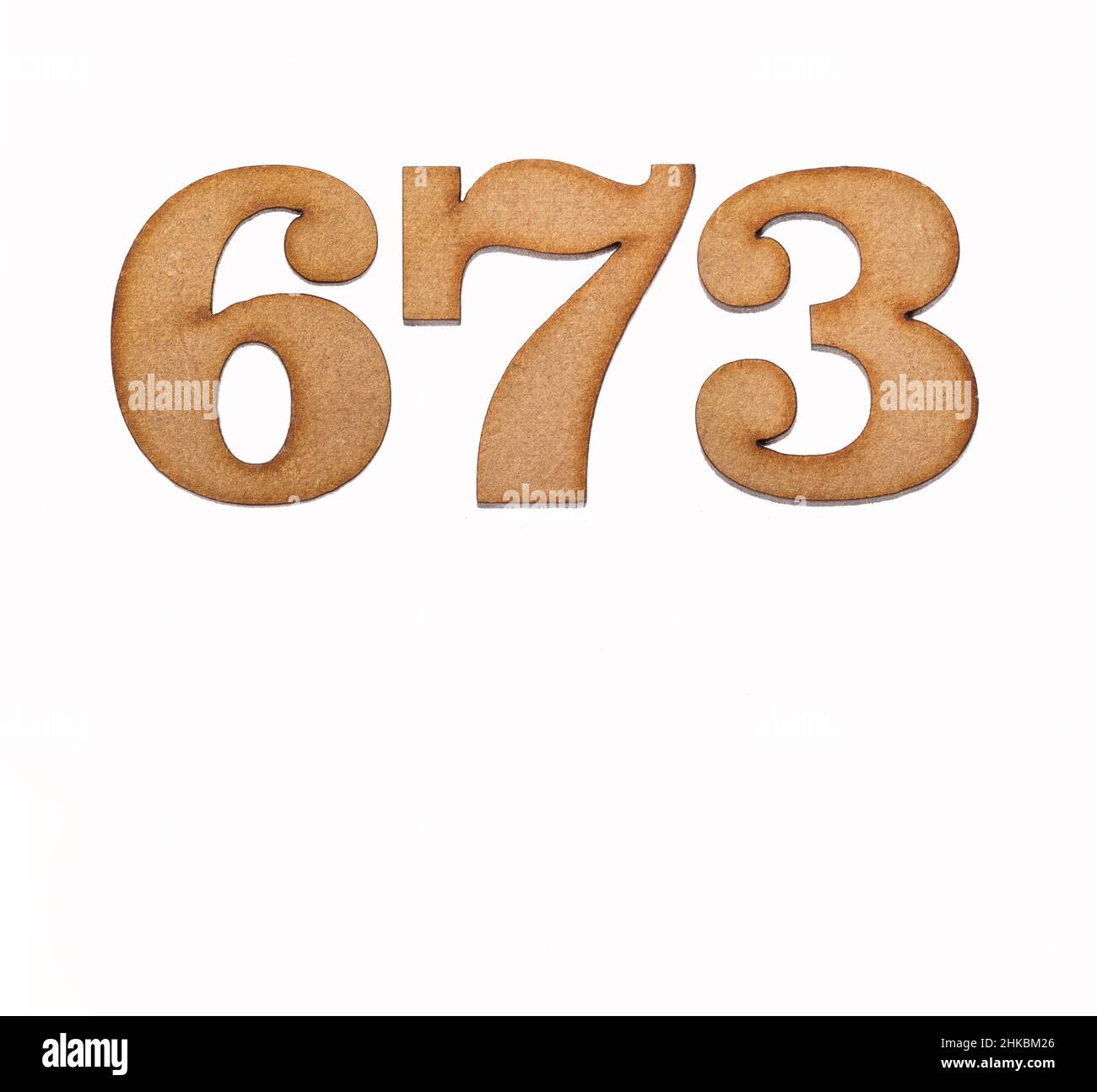 Number 673 in wood, isolated on white background Stock Photo - Alamy