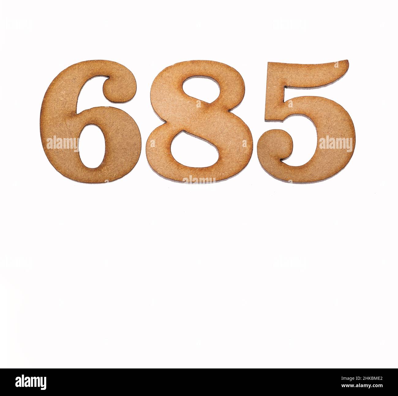 Number 685 in wood, isolated on white background Stock Photo - Alamy