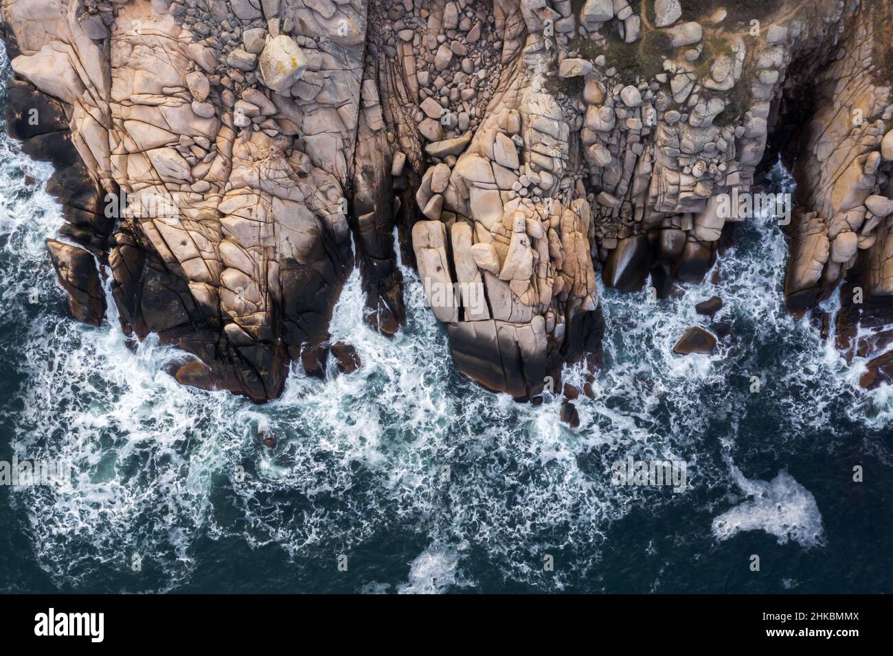 Aerial view of waves crash to the cliffs Stock Photo - Alamy