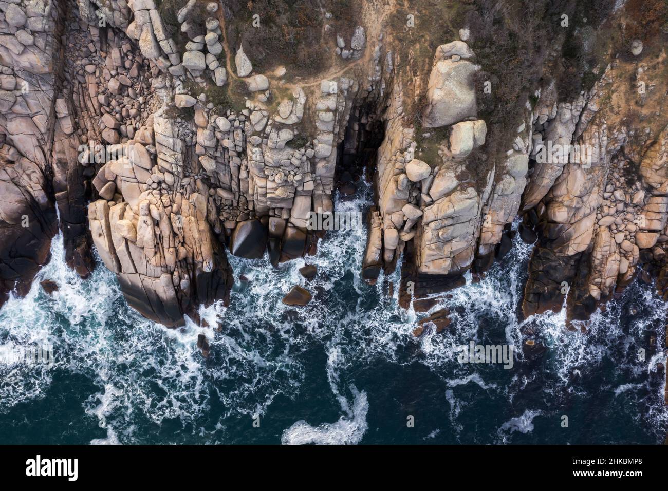 Aerial view of waves crash to the cliffs Stock Photo - Alamy