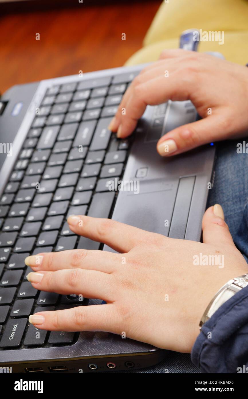 Typing person on laptop Stock Photo - Alamy