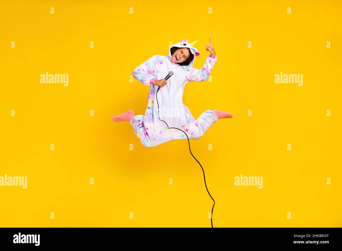 Full body photo of young black girl sing song mic show fingers horns ...