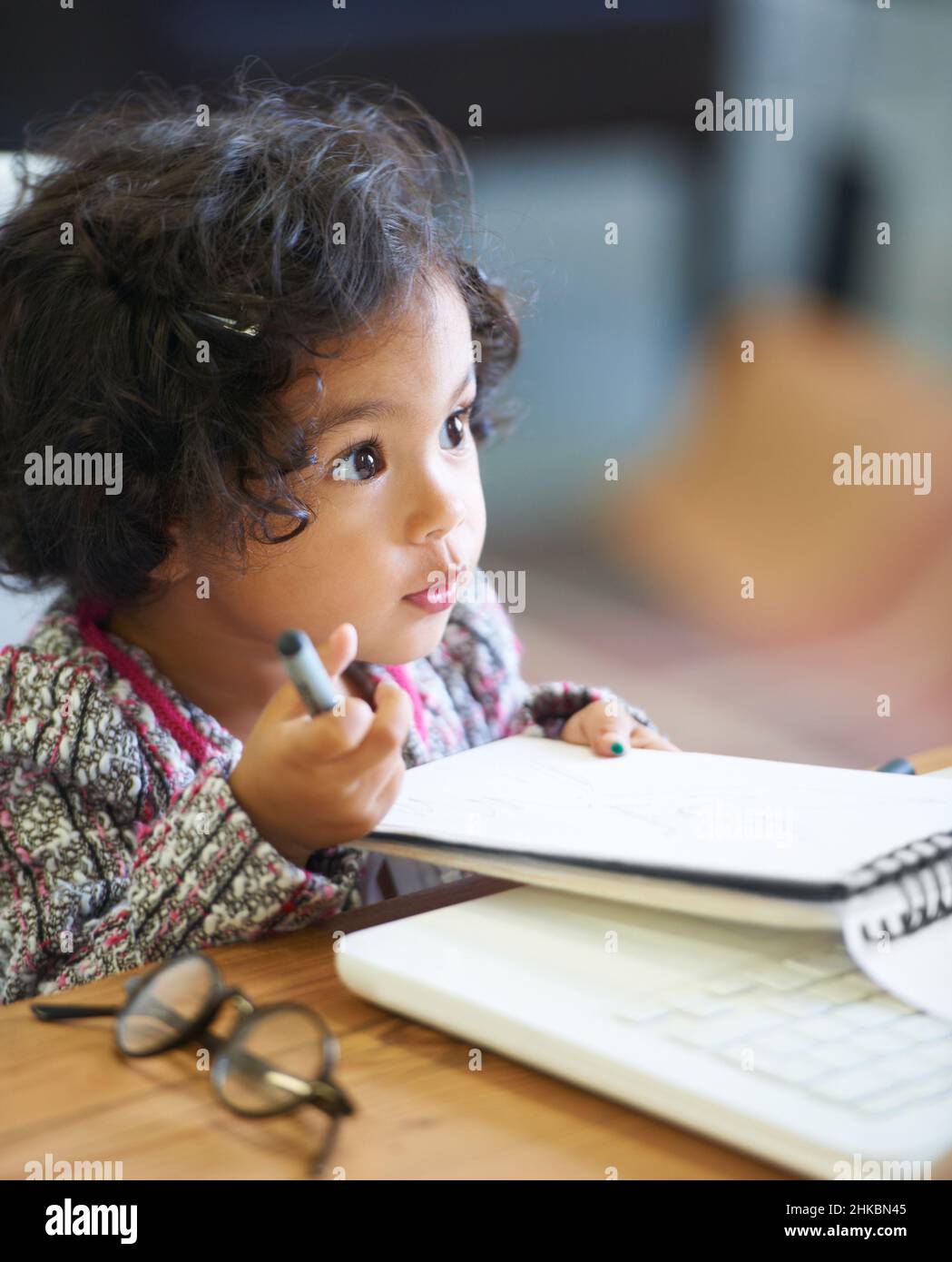 Learning as she grows. Shot of a cute little girl at home Stock Photo ...