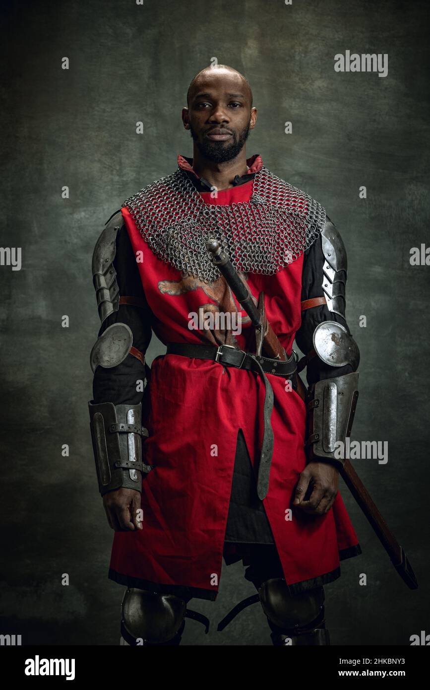 Vintage style portrait of brutal dark skinned man, medieval warrior or ...