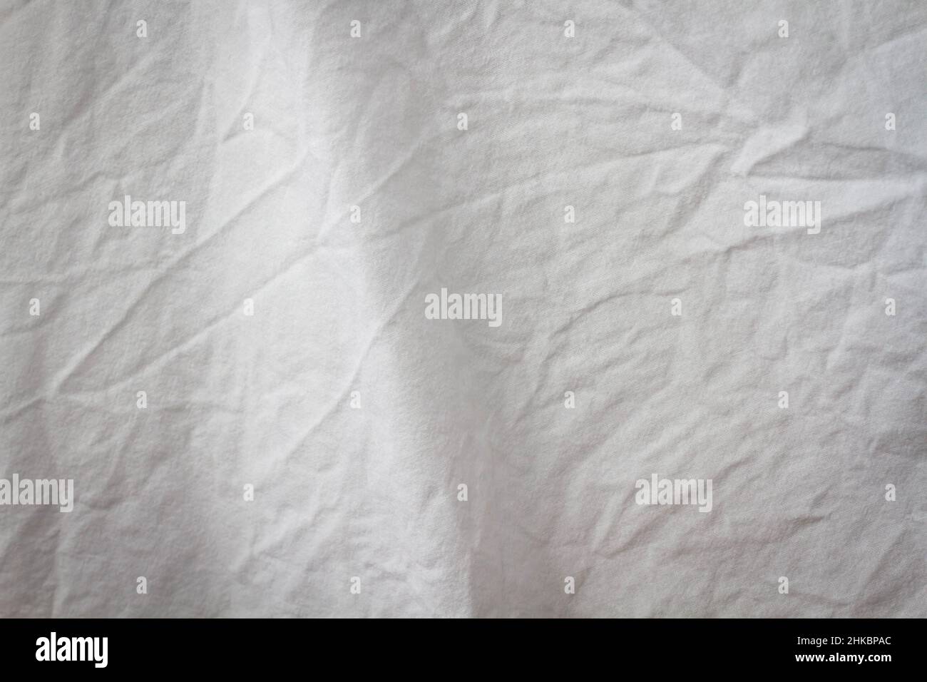Wrinkled sheet. White fabric close-up. Burlap texture. Sheet on the bed ...