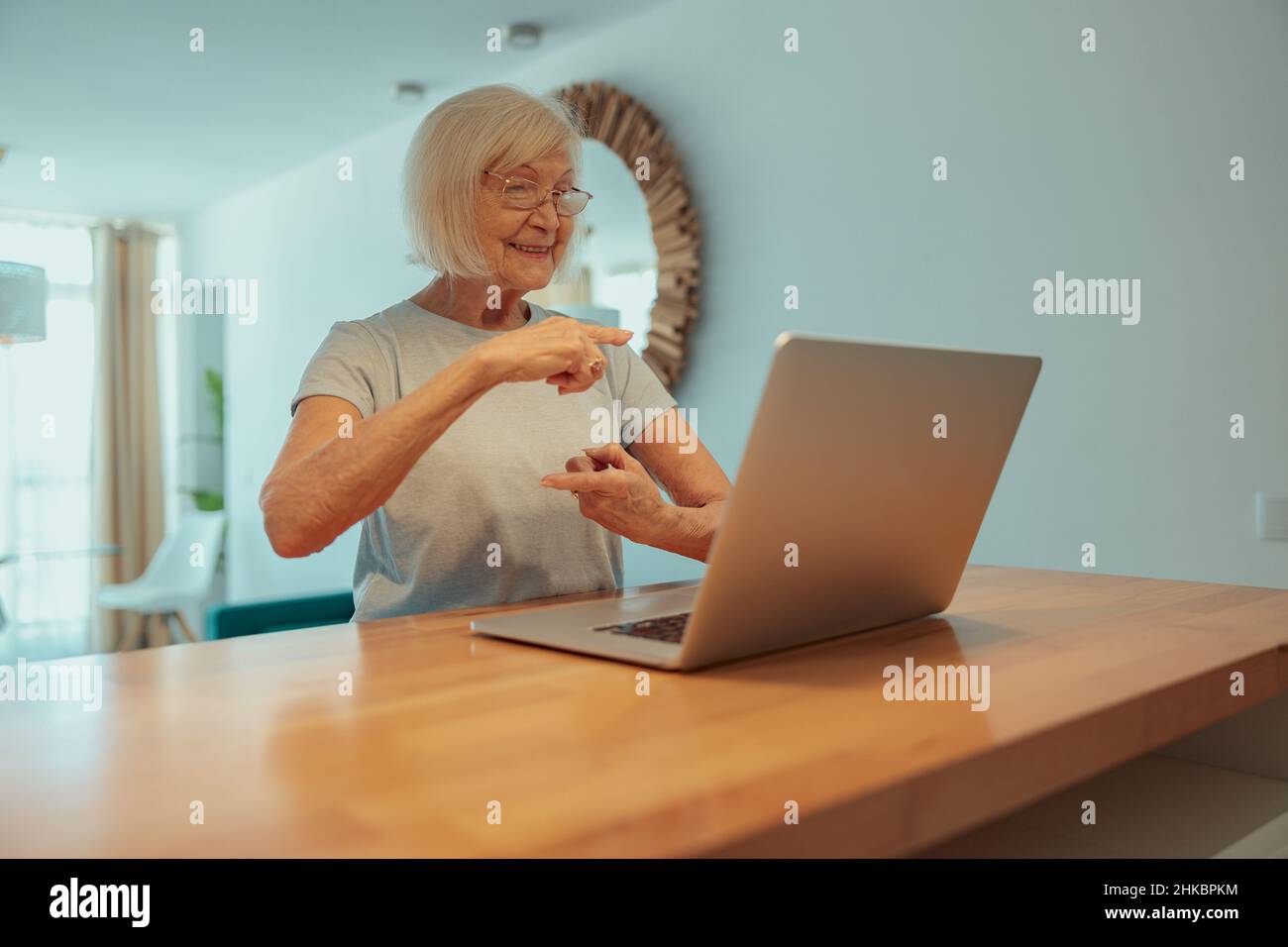 Retired woman on computer hi-res stock photography and images - Alamy