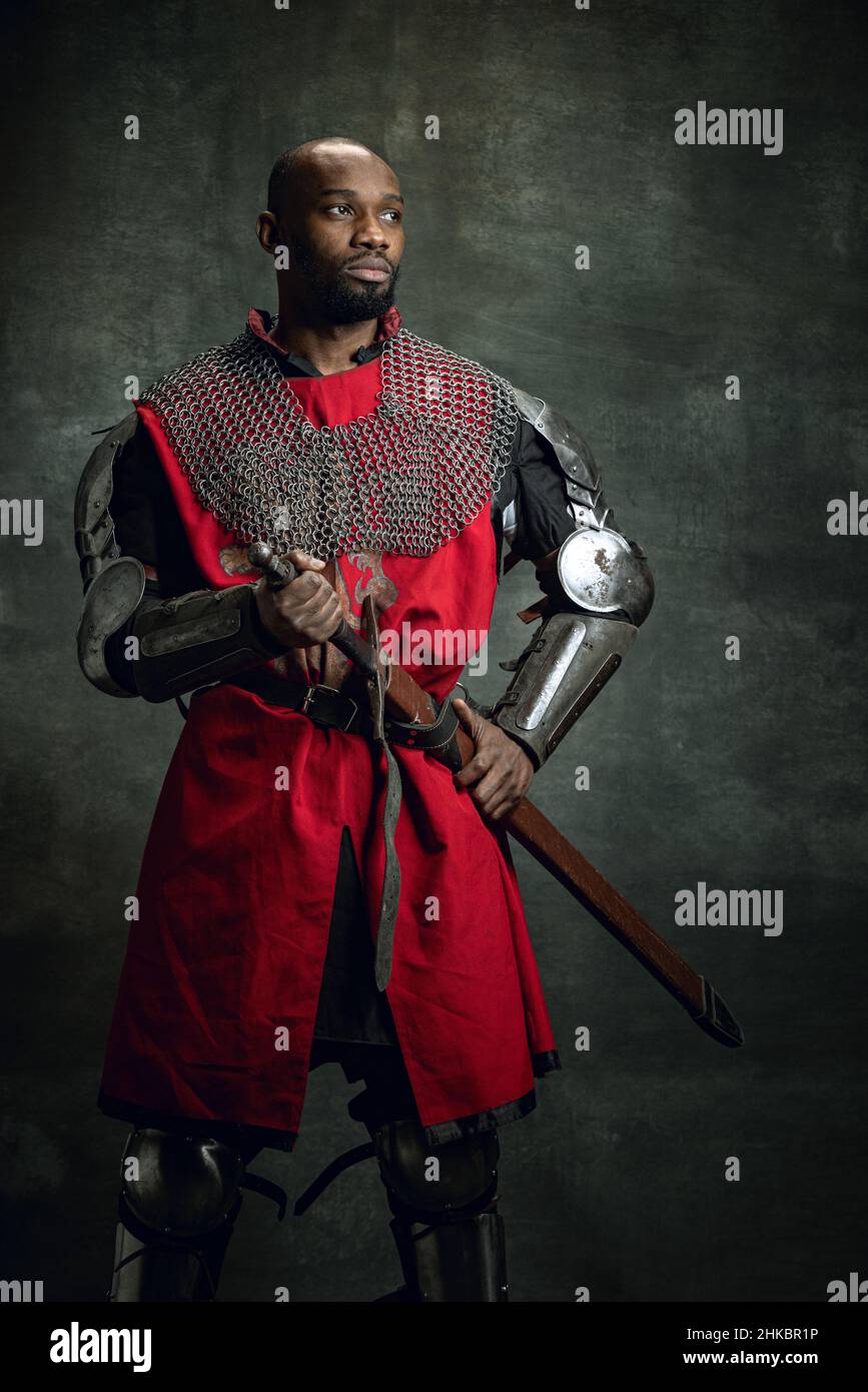 Vintage style portrait of brutal dark skinned man, medieval warrior or ...