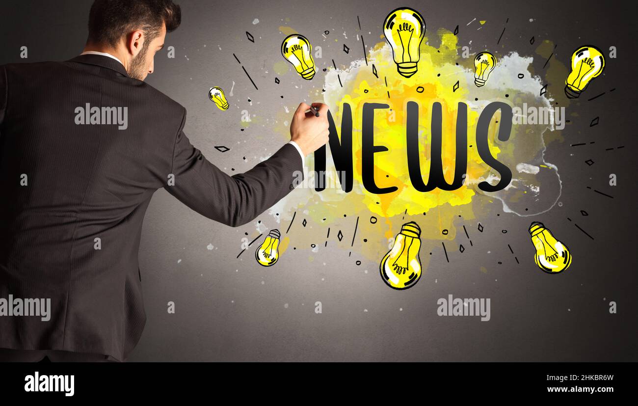 man drawing colorful light bulb Stock Photo - Alamy