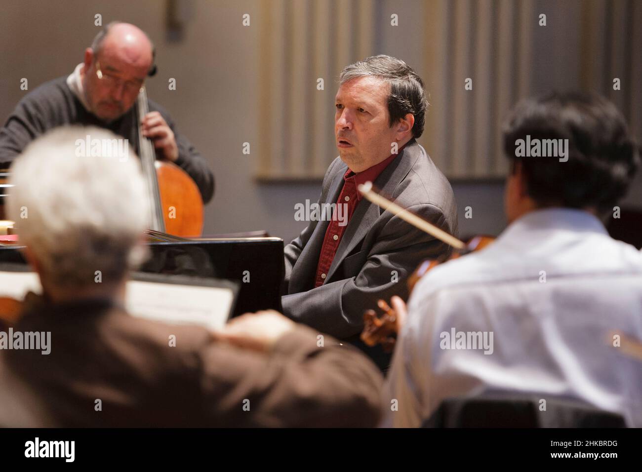 American pianist and conductor, Murray David Perahia, conducting a ...