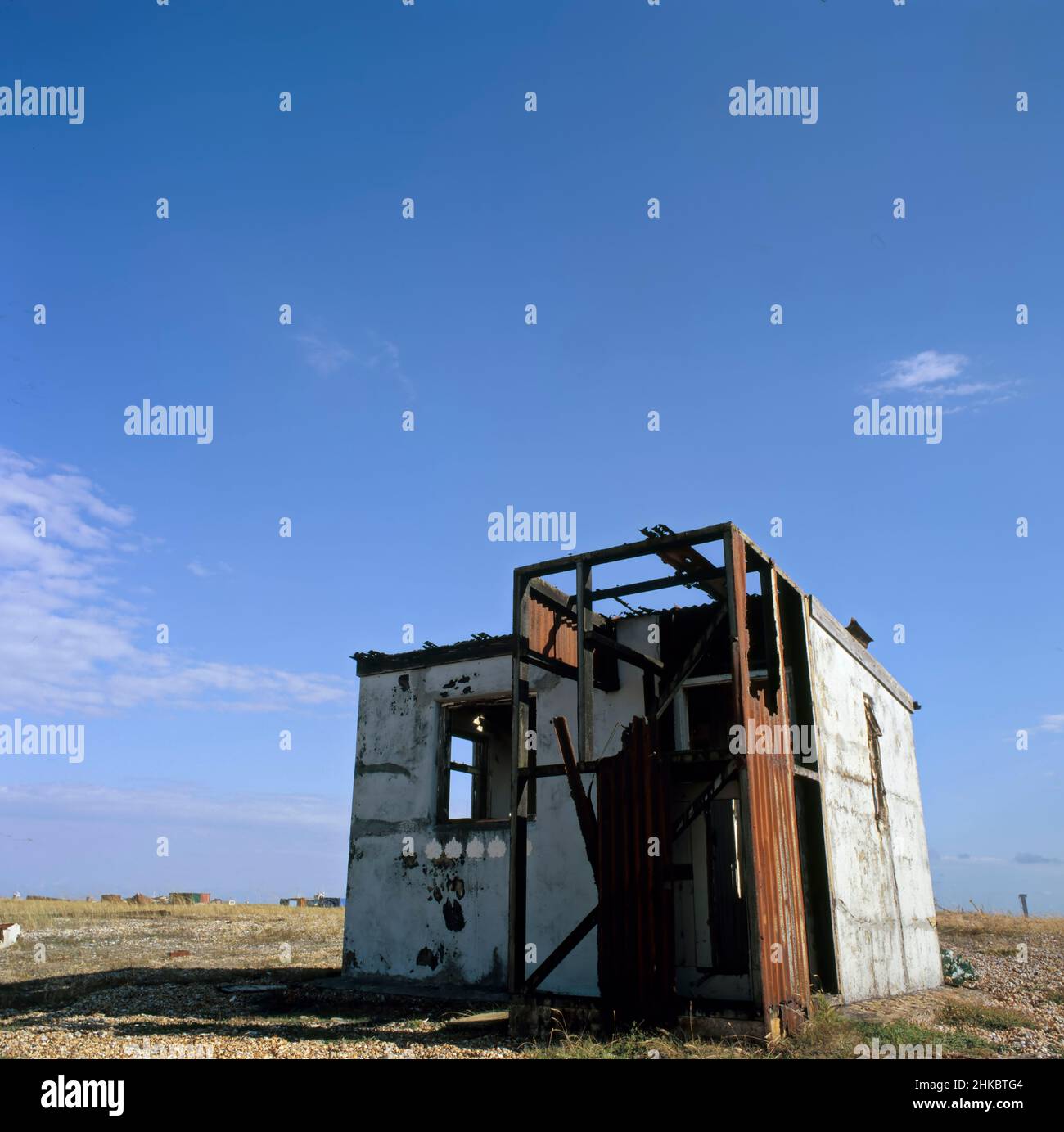 Disused building on the shingle at Dungeness, Kent, England. Many of ...