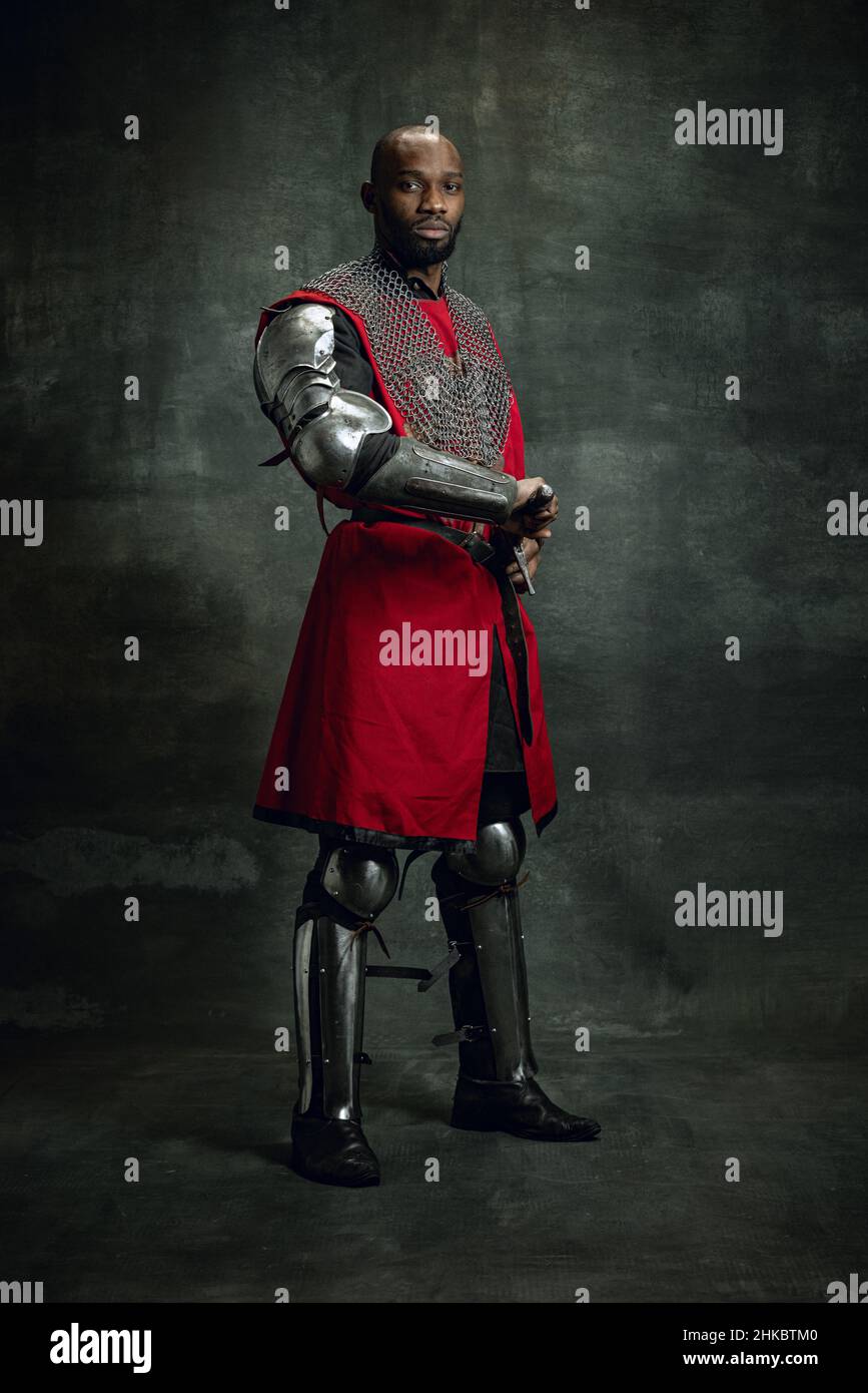 Vintage style portrait of brutal dark skinned man, medieval warrior or ...