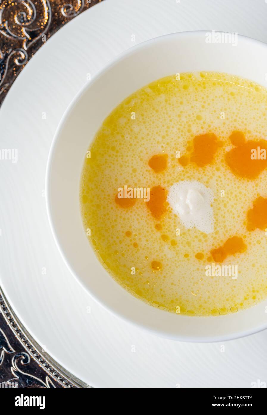 Seasoned fish soup on a white porcelain plate Stock Photo - Alamy
