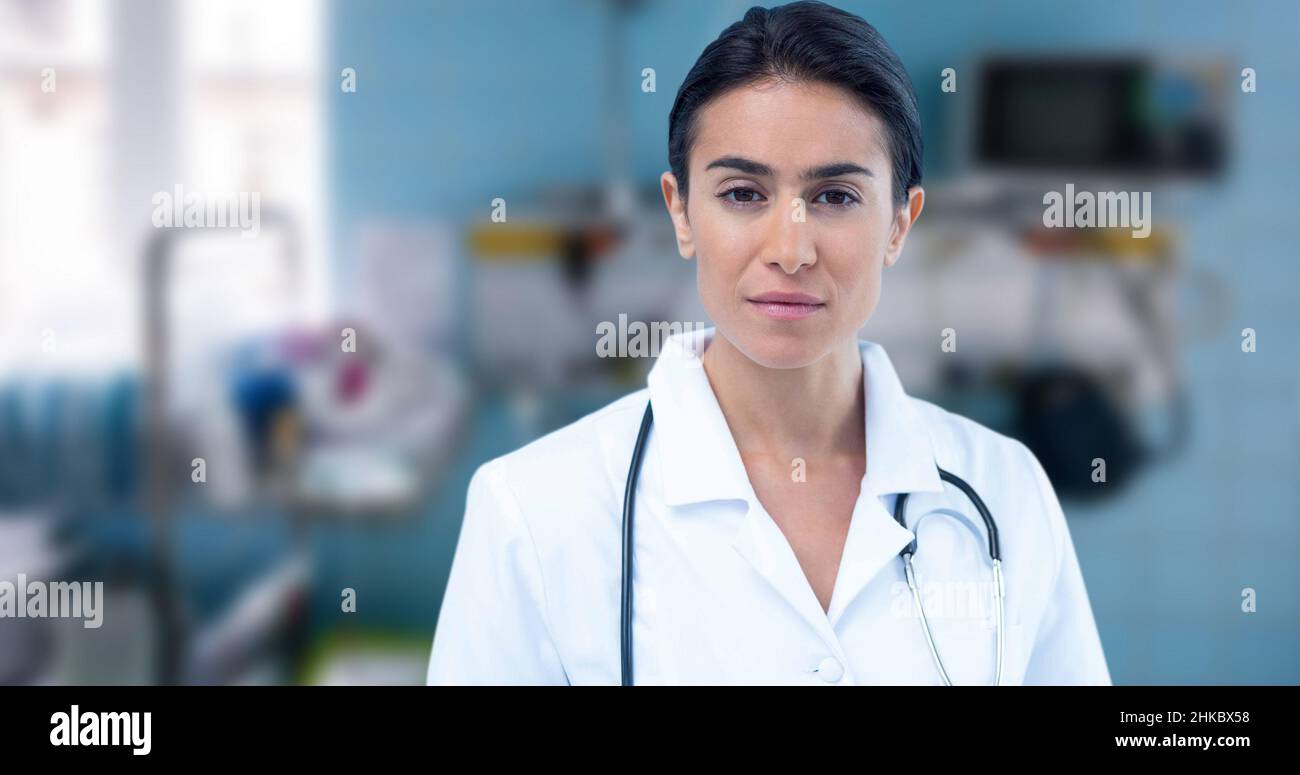 Portrait of confident biracial female doctor standing in hospital Stock ...