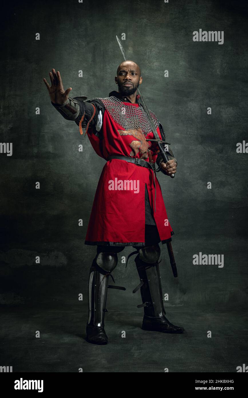 Vintage style portrait of brutal dark skinned man, medieval warrior or ...