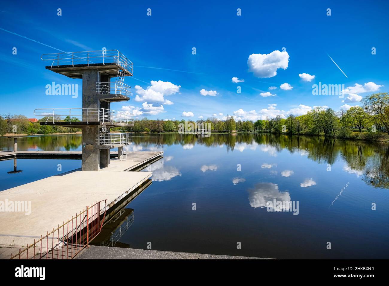 Beautiful lake with diving platform on bright summer day Stock Photo ...