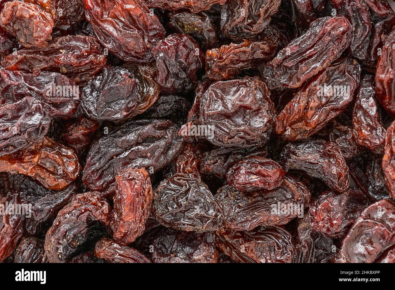 Dark raisins as background. Top view, food background Stock Photo - Alamy