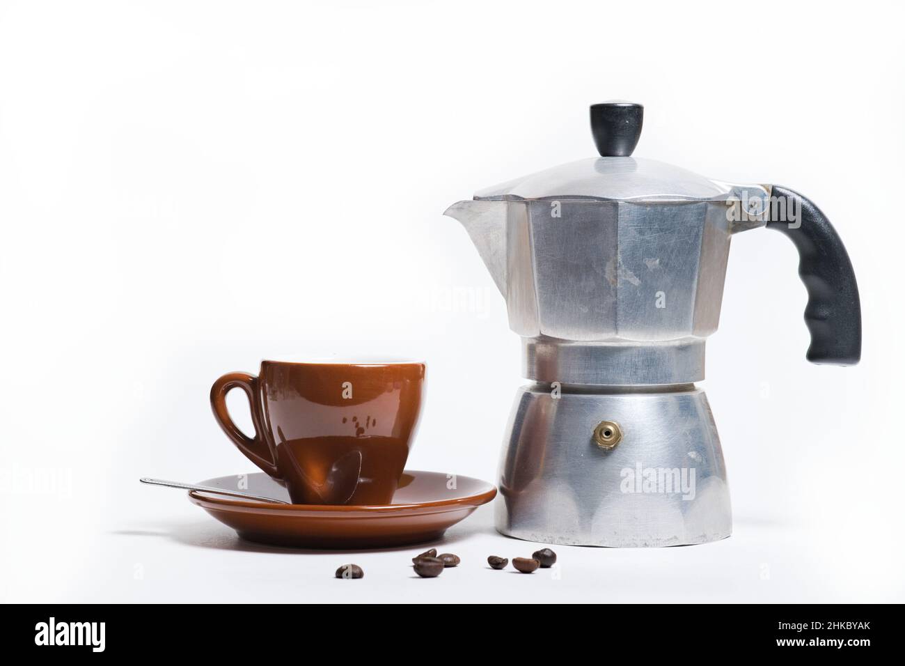 traditional espresso maker with brown cup and saucer o Stock Photo - Alamy