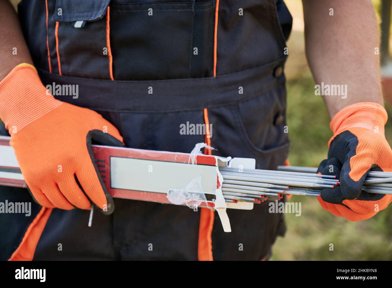 Glove hand holding stick hi-res stock photography and images - Alamy
