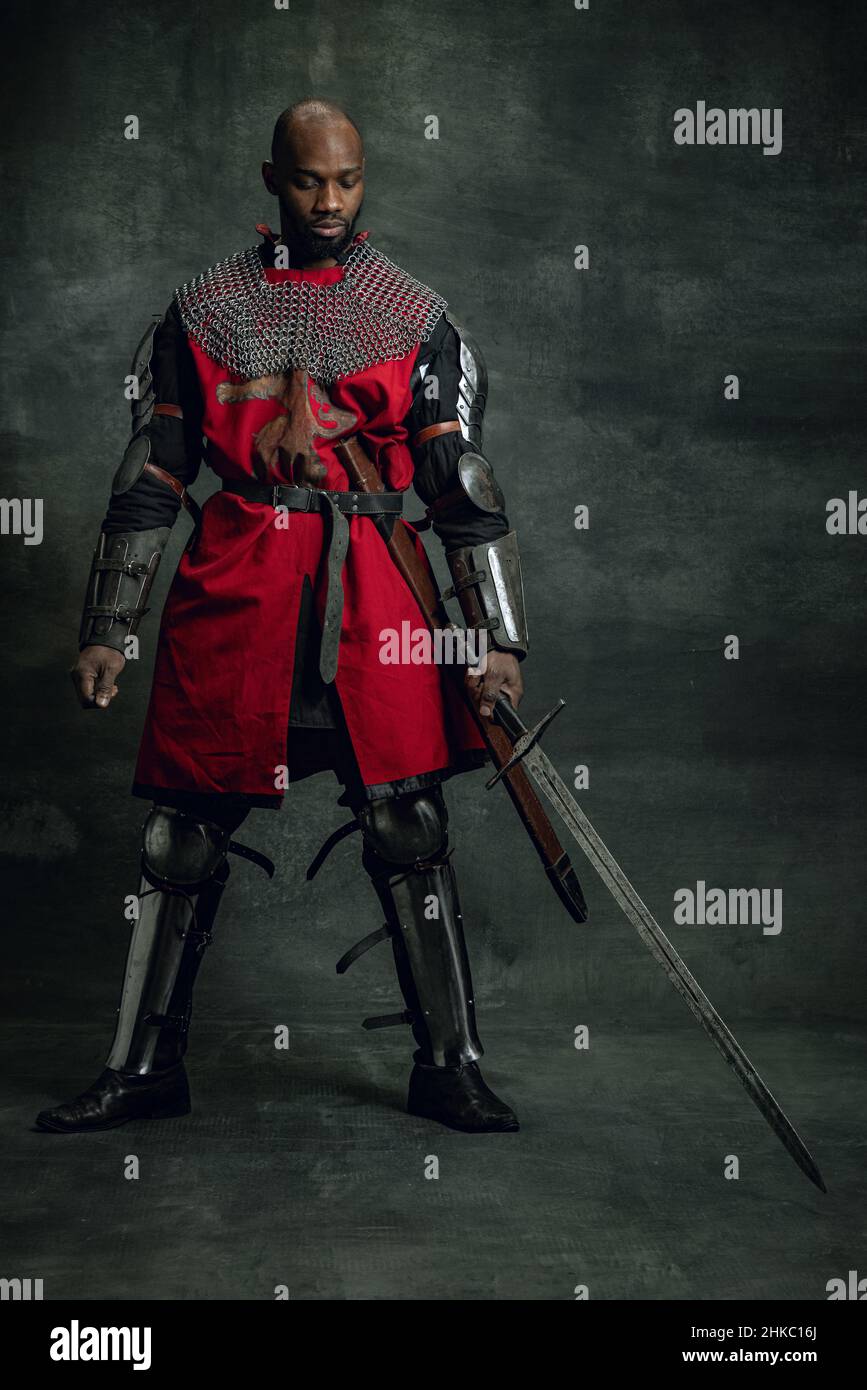 Vintage style portrait of brutal dark skinned man, medieval warrior or ...