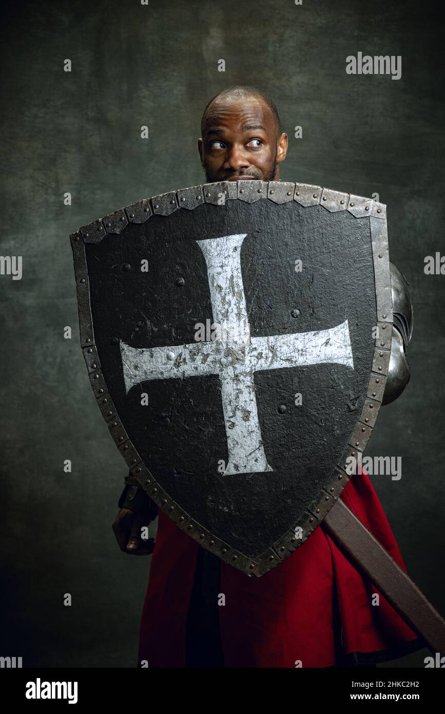 Portrait of medieval warrior, dark skinned bald knight with dirty ...