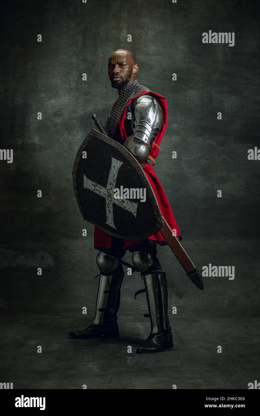 Vintage style portrait of brutal dark skinned man, medieval warrior or ...