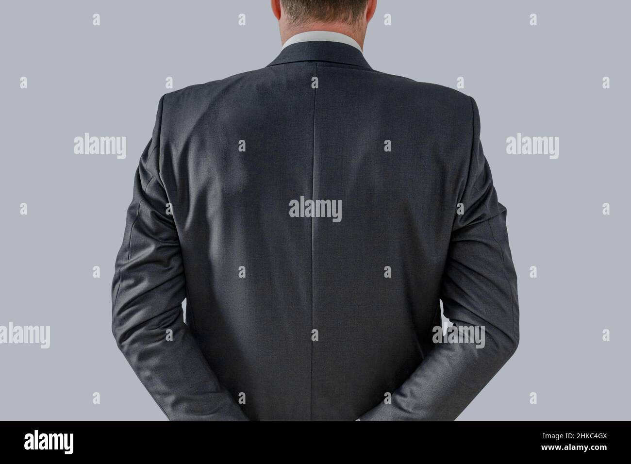 Businessman back over in elegant custom tailored expensive suit posing ...