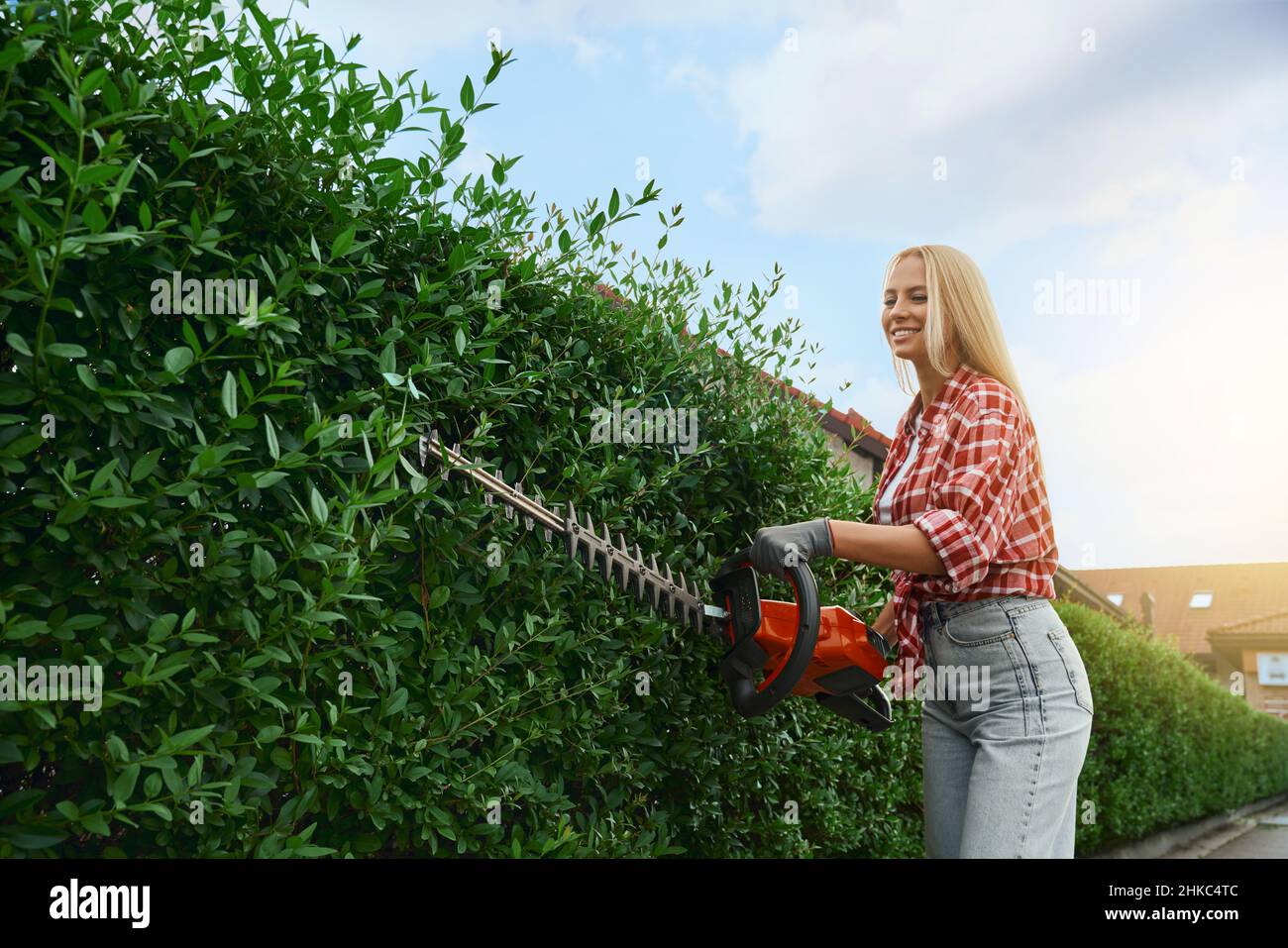 Trimming bushes hi-res stock photography and images - Alamy
